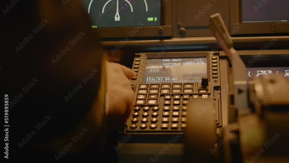 Plane captain using dashboard buttons to insert coordinates, flying ...