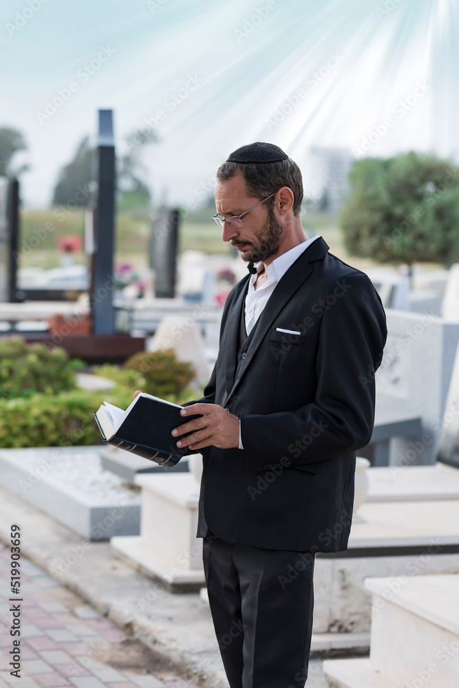 Bearded Jew in black kippah reading a Hebrew Bible, praying, selective ...