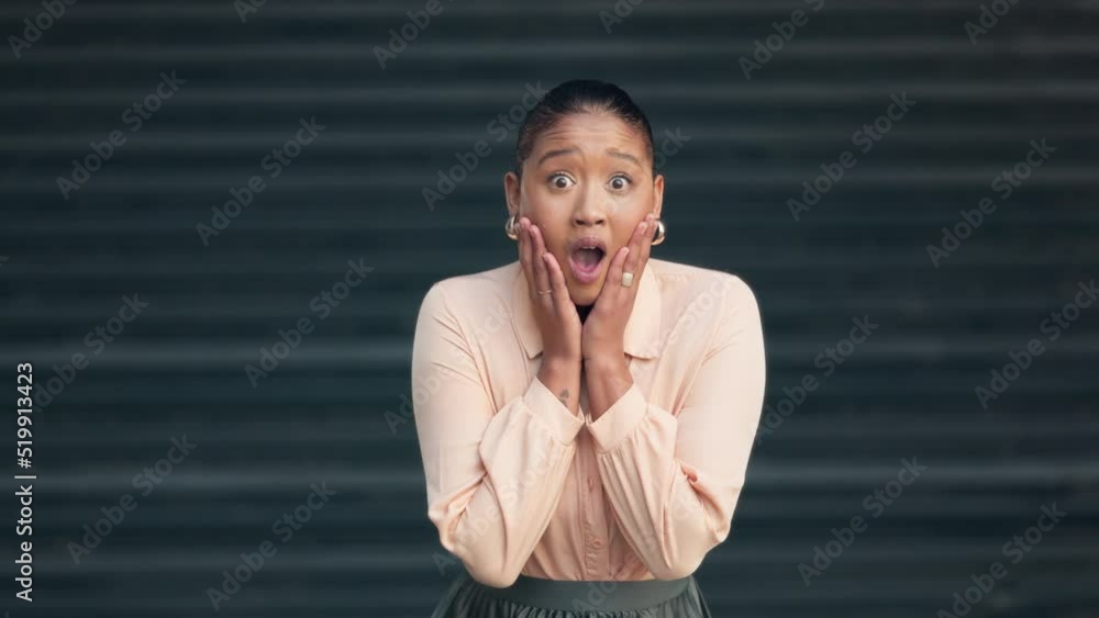 Shocked, surprised and amazed woman with hands on face looking alarmed ...