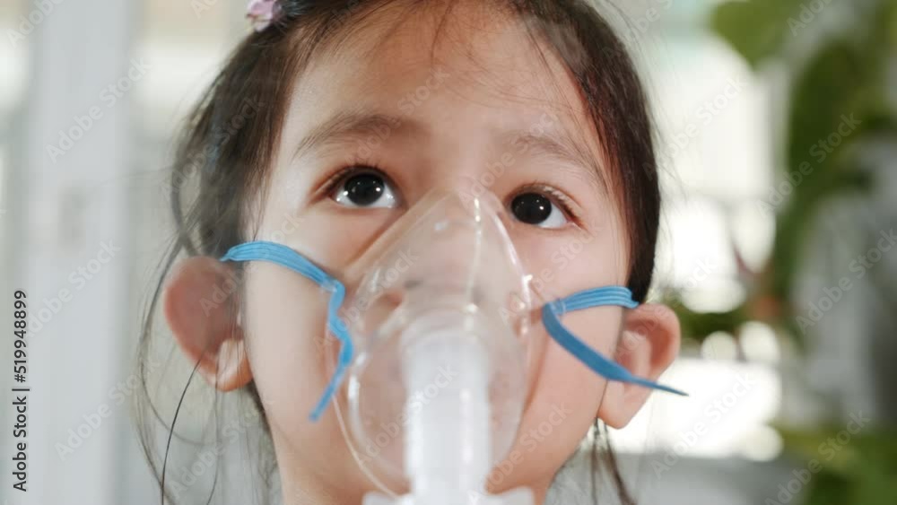 Kid girl making makes inhalation nebulizer steam sick cough at home ...