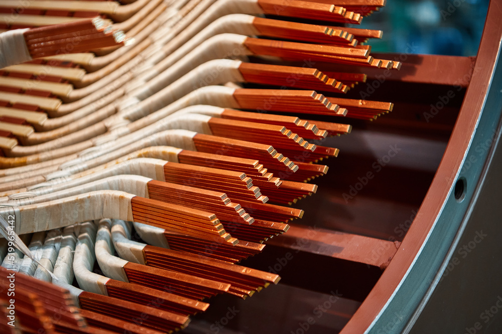 The stator of an industrial electric motor at the assembly stage. Thick ...
