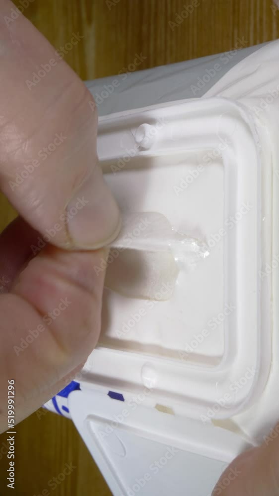 Vertical video social media format – Closeup of a man’s hand opening ...