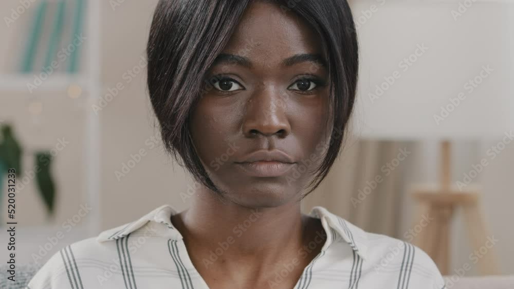 Video Stock Female portrait close-up sad face upset young african ...