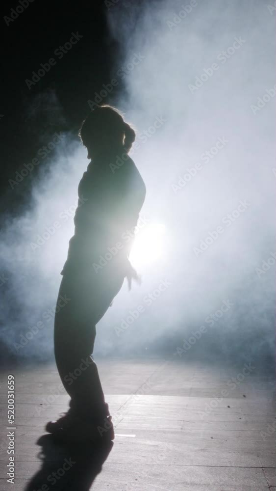 Vertical video of a Young female dancer performing hip hop dance in ...