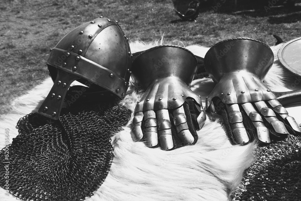 Knight helmet and gauntlets on fur. Middle ages armor still life ...