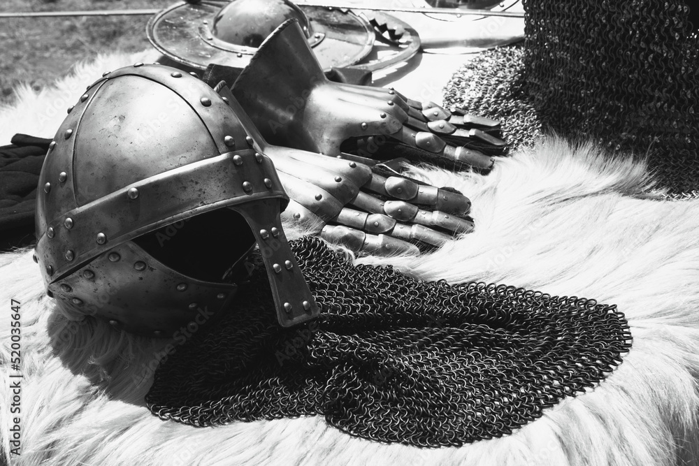 Knight helmet and gauntlets on fur. Middle ages armor still life ...