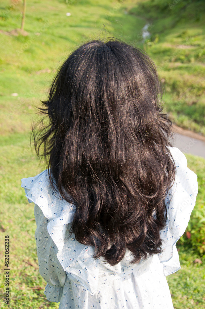 Back view of little girl's hair cut. Little girls with curly hair are ...