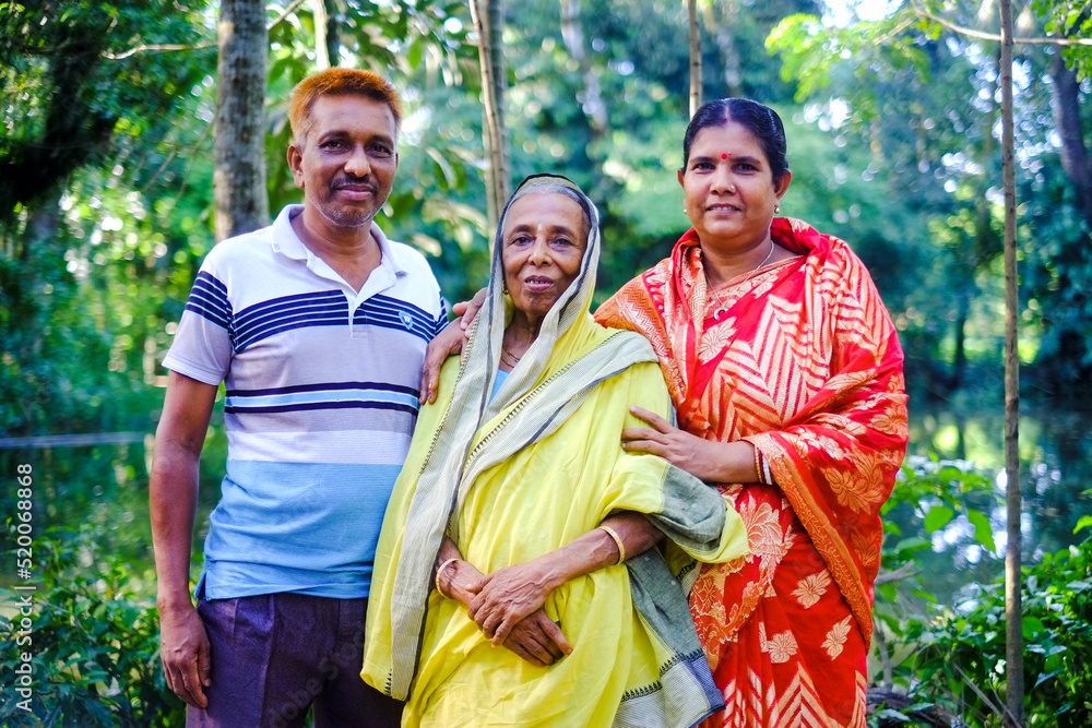 Bangladeshi family photo, south asian hindu religious nuclear family in natural environment ...