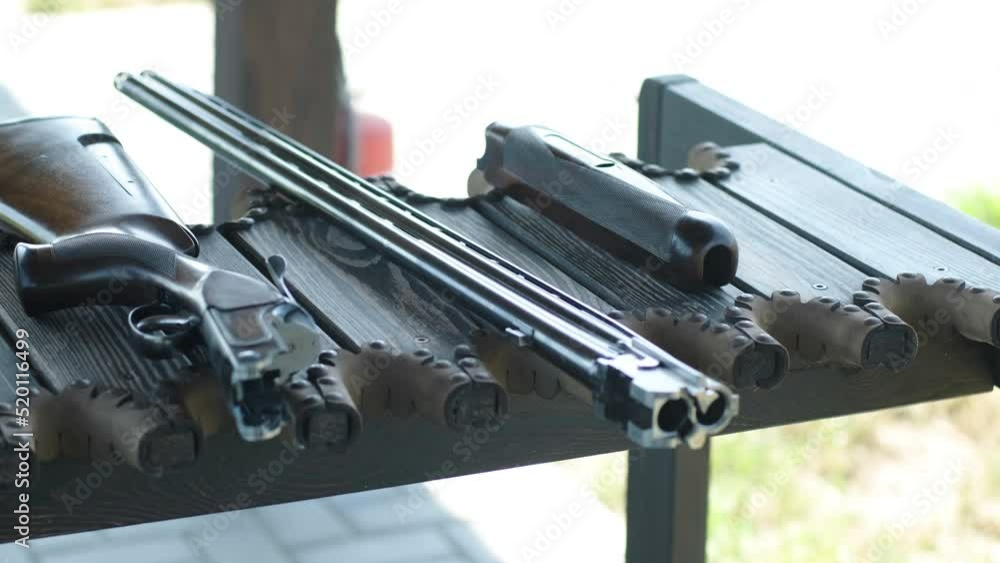Double-barreled shotgun at the table. sports field for a shooting test ...