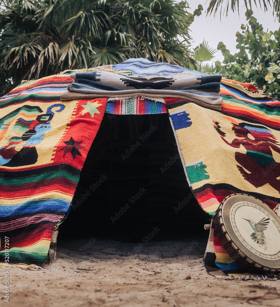 Traditional Maya sauna temazcal full covered with mexican colorful ...
