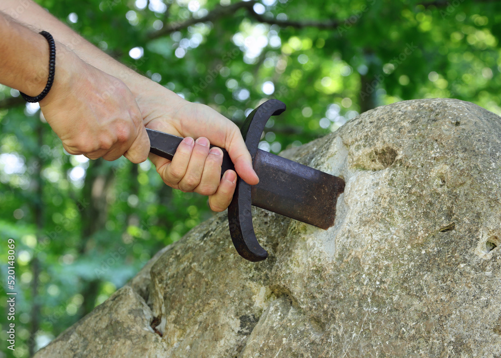 Photo & Art Print hand and sword in the stone as in the legend of King ...