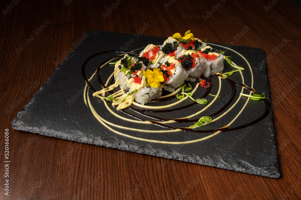 Japanese sushi food. Maki and rolls with tuna, salmon, shrimp, crab and ...