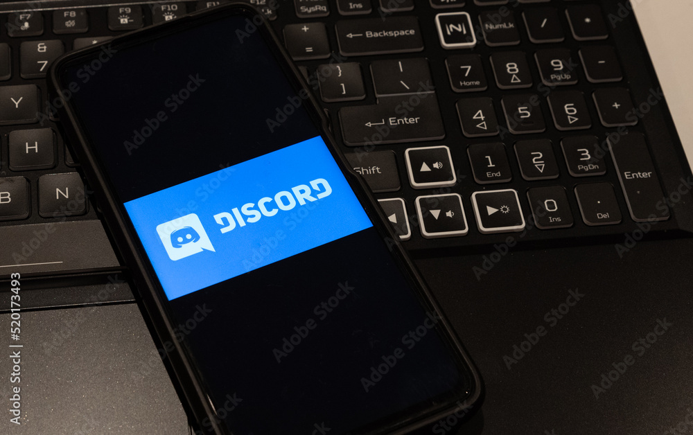 discord logo on mobile phone , background is a keyboard July 30 2022 ...