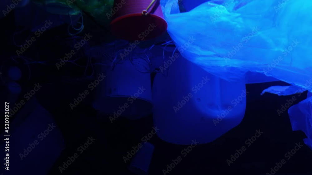 Plastic Waste floating in dark deep water. Ocean Plastic Pollution ...