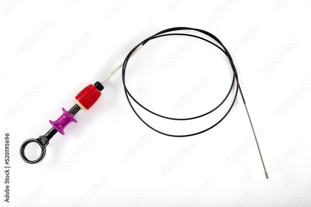 A balloon inflation device used in angioplasty procedure. Mesh metal ...