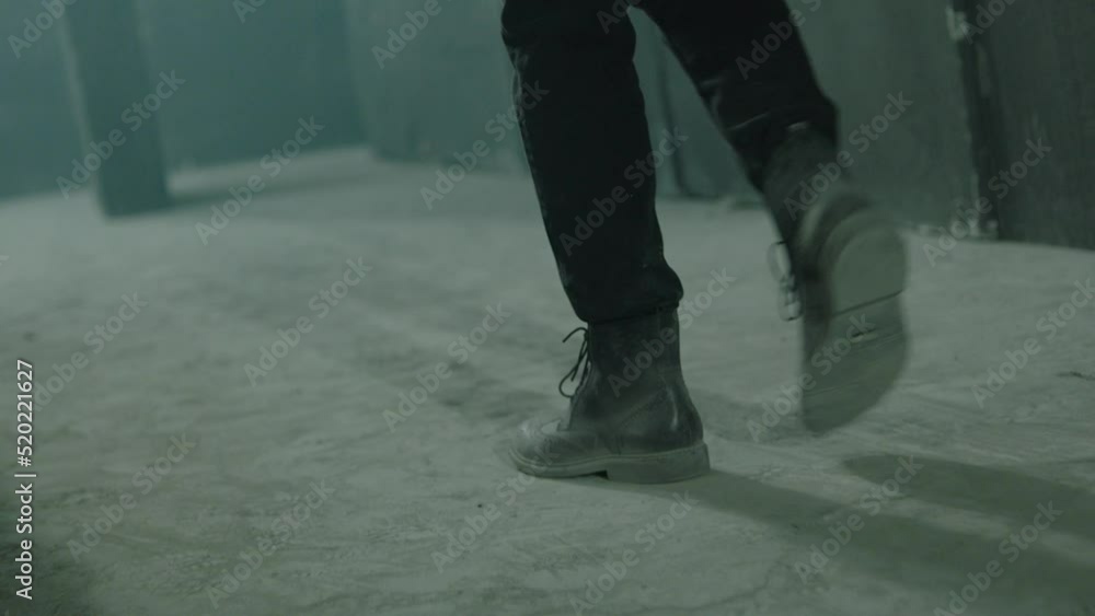 Close up of male legs in black boots . Rear back view of unknown man ...