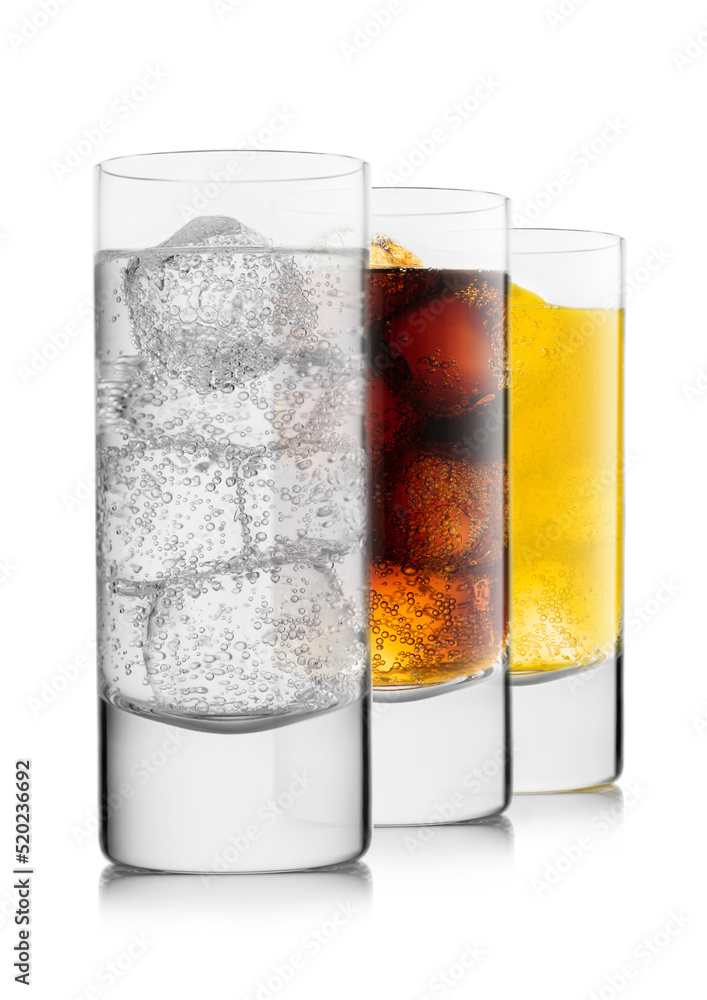 Lemonade drink with cola and orange soda with ice cubes on white background in highball glasses ...
