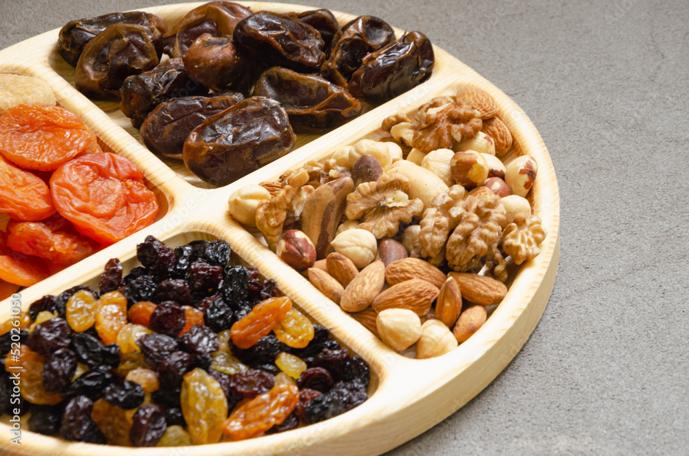 combined plate with dried fruits and nuts. in each compartment of the ...