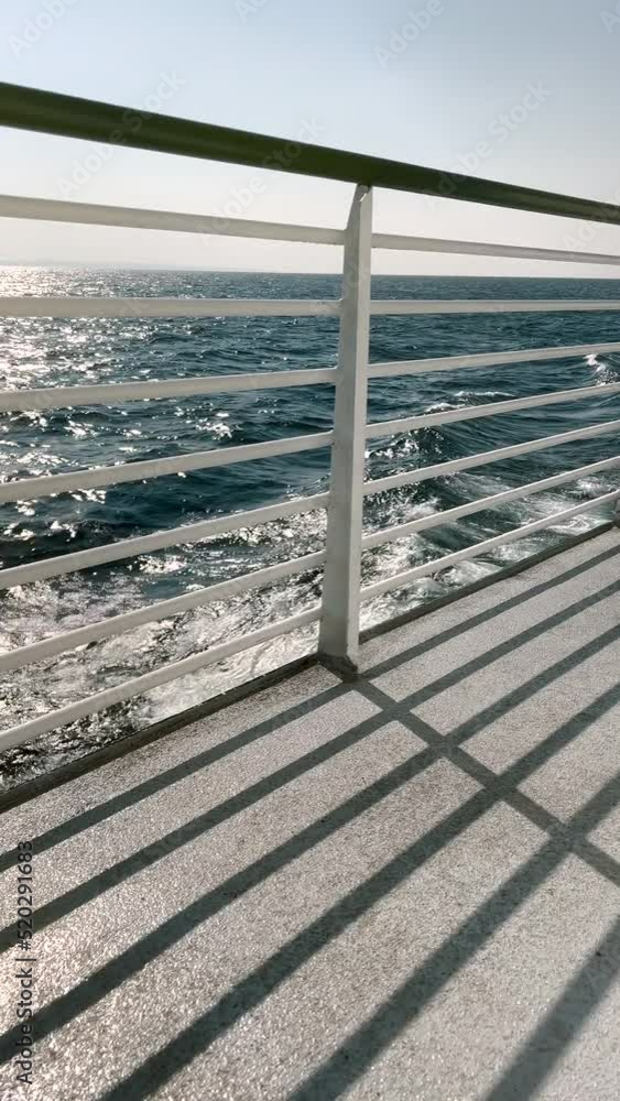 Point of view from ground level on the deck of a large ferry boat. The ...