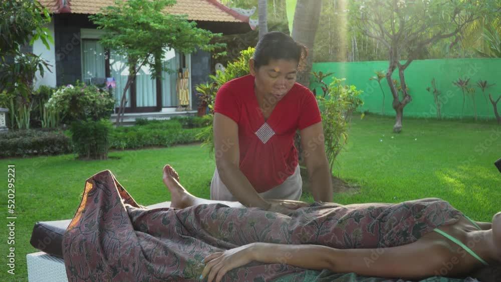 Asian Woman Massage Therapist Doing Massage To Girl Summer Vacation On Luxury Spa Resort