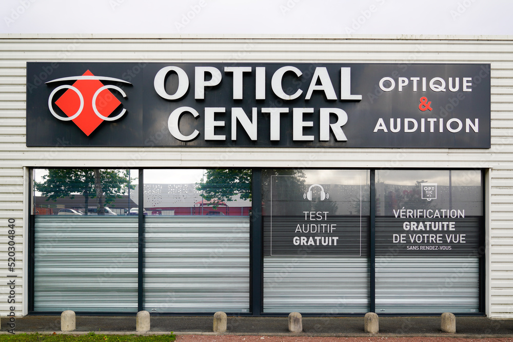 Optical center logo text and brand sign on entrance building store of ...