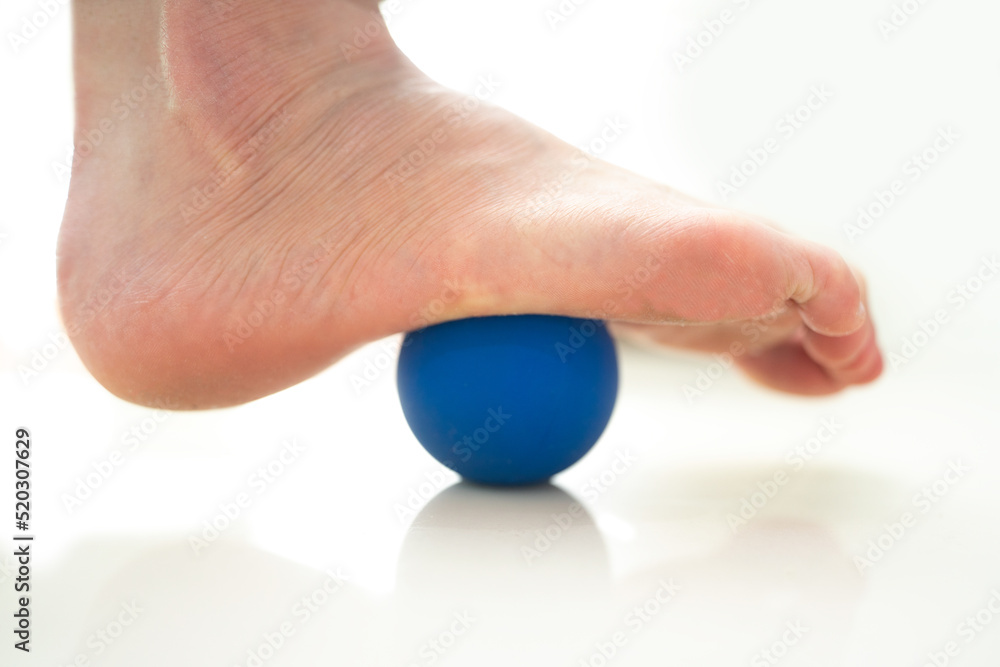 massage ball rolling on the plantar surface of foot. Treatment for ...
