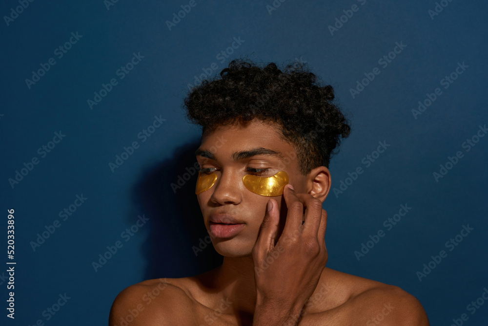 Partial image of black guy apply under eye patch Stock Photo | Adobe Stock Partial image of black guy apply under eye patch Stock Photo | Adobe Stock