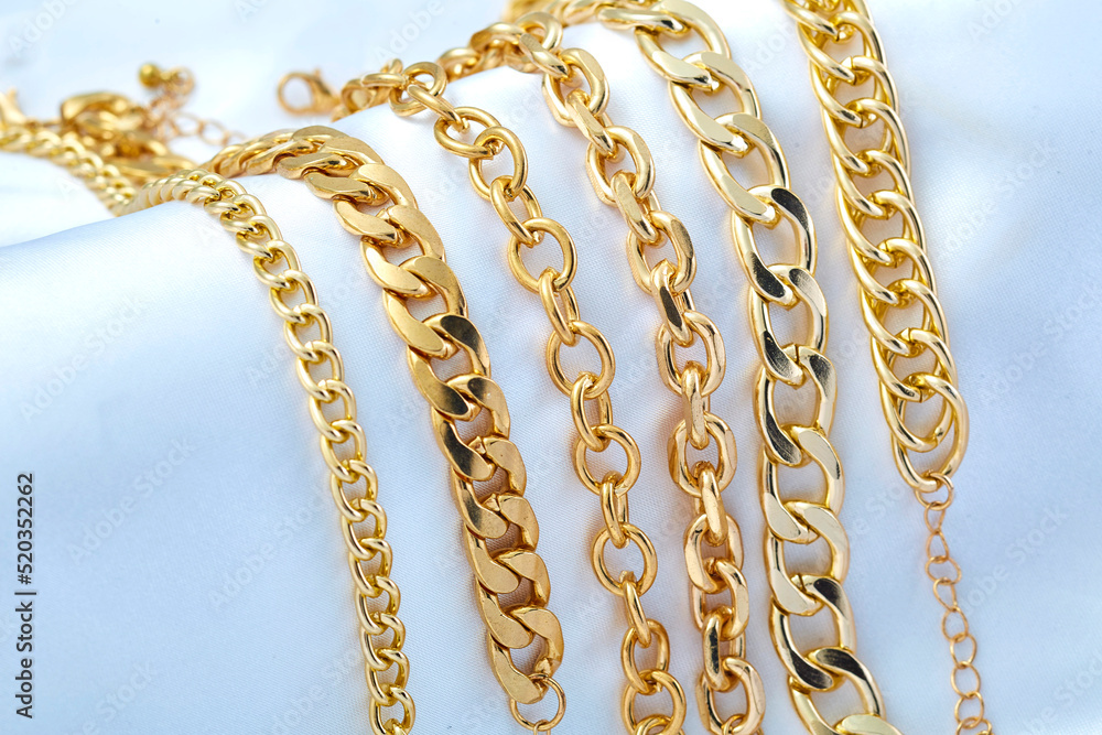 Gold jewelry on white background Stock Photo | Adobe Stock