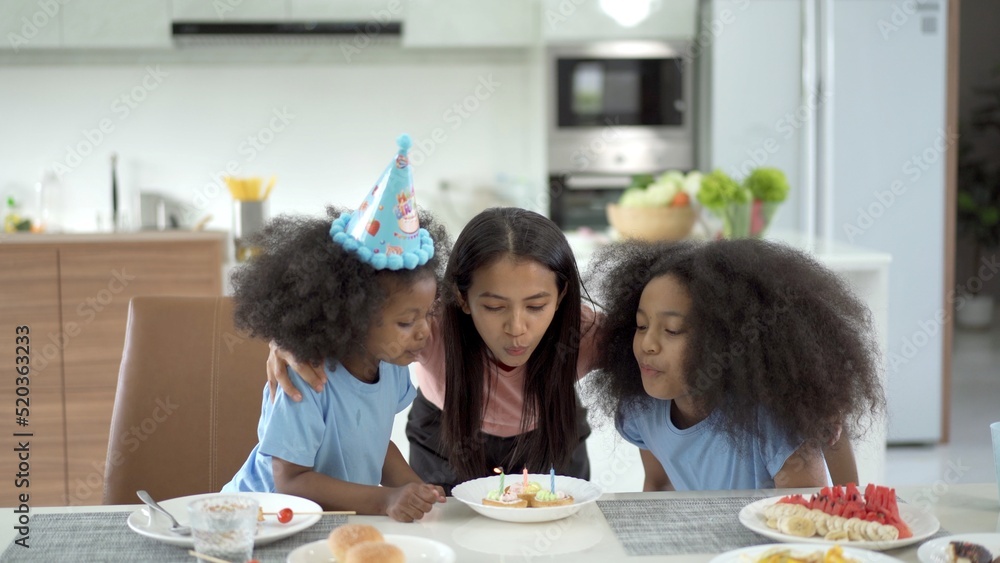 Happy family celebrating a birthday together, mother and daughter ...