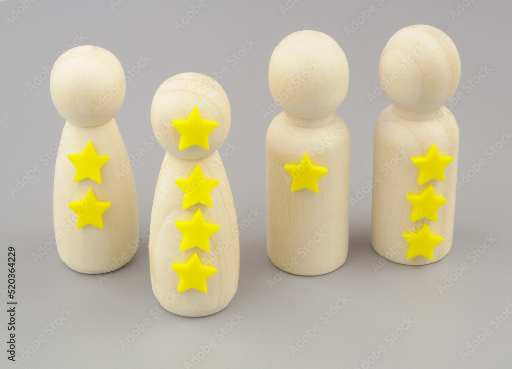 Rating and ranking people concept. Wooden people figures with different ...