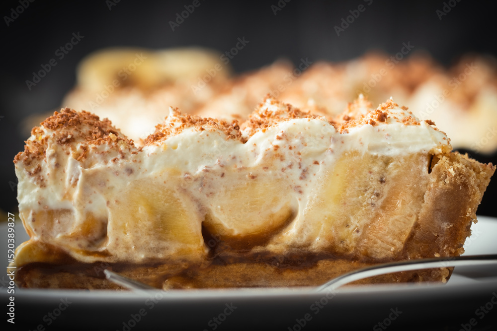 Banoffee cake with banana and caramel sauce filling sprinkled with ...