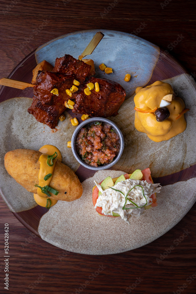Piqueo peruano, tapeo, anticucho y huancaina Stock Photo | Adobe Stock