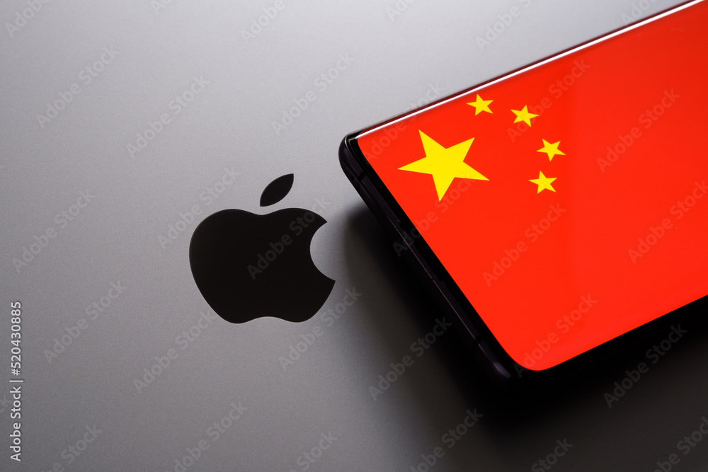 Apple in China. Concept. Chinese flag seen on smartphone which is ...