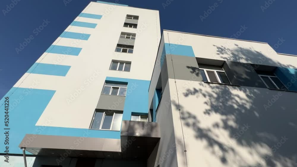 Hospital building exterior on a clear sunny summer day. Bottom up view ...