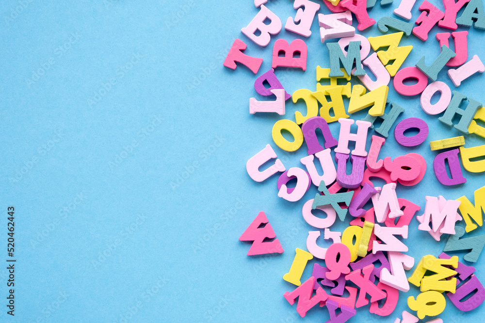 Wooden multi colored letters with copy space. Flat lay, top view. Light ...