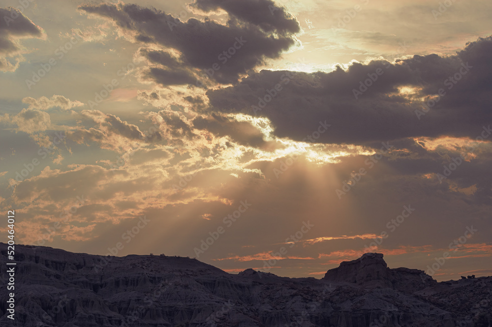 Dramatic sun rays and clouds sky in late afternoon in the Mojave Desert ...
