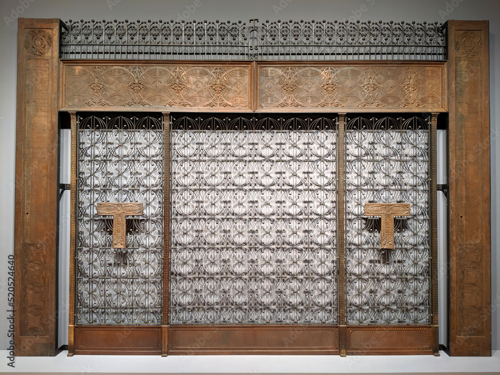This elegant grille was designed to screen the elevator in an early ...