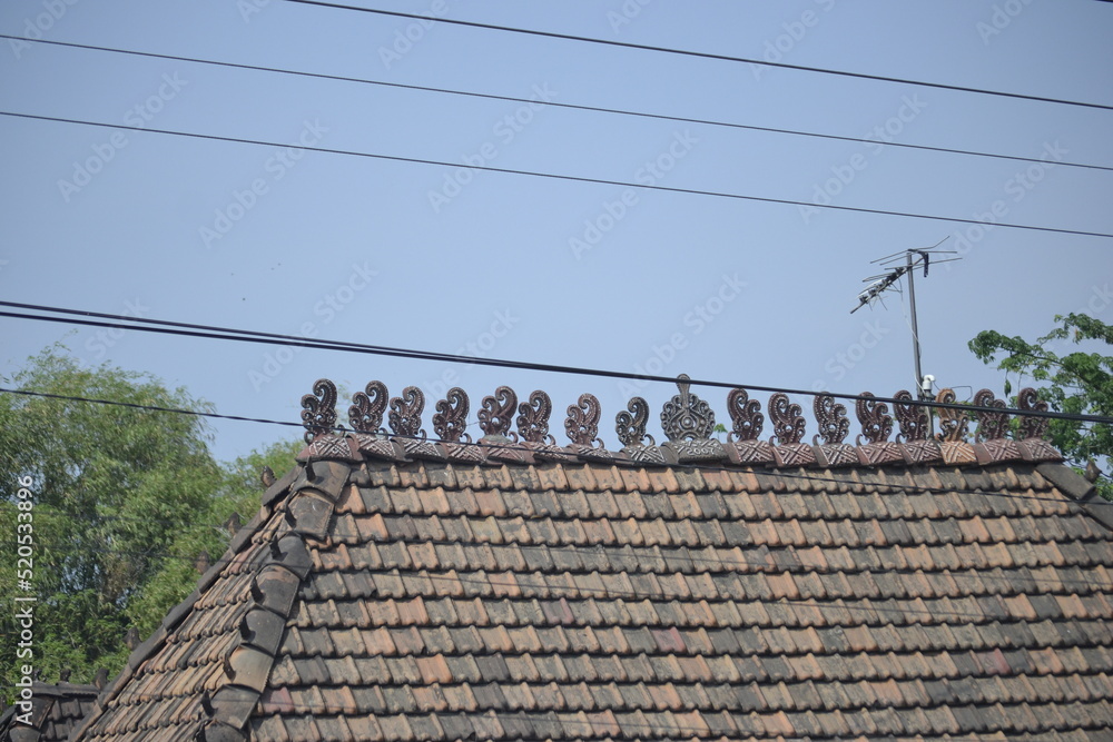the roof of a traditional east java house. The roof of the house is ...