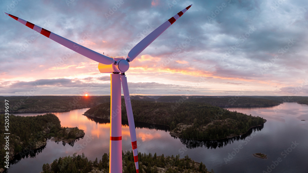Wind turbine. Windmill above trees and river. Wind turbine on sunset ...