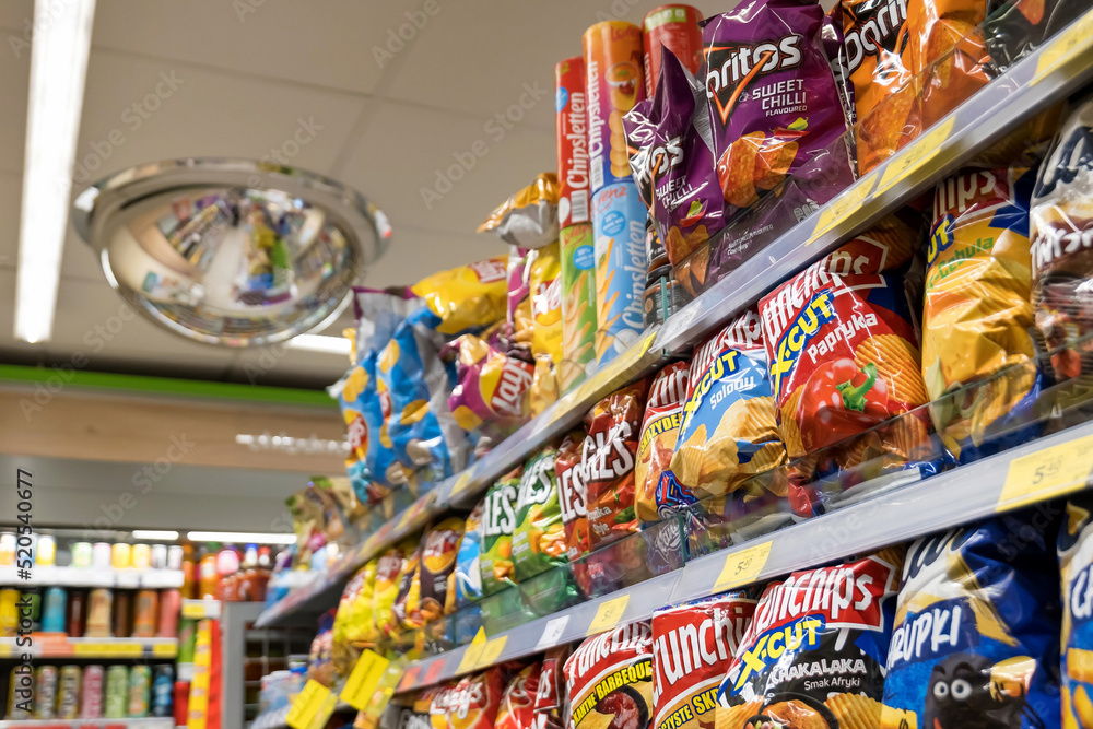 Lots of chips and crisps in a Zabka convenience store, product display ...