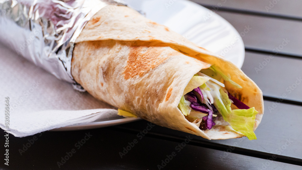 Delicious doner kebab wrap as dürüm in yufka flatbreads in Turkish fast ...