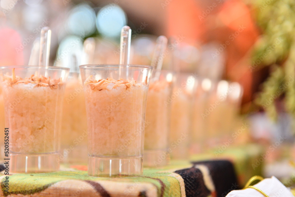 glasses on a table, rice pudding in a cup, typical food, June food, São ...