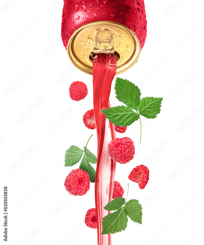 Red drink pours from a metal bottle with raspberries and leaves ...