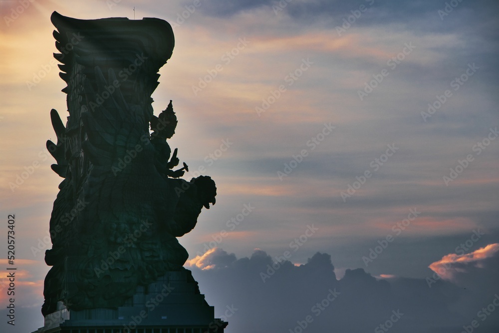 Patung Garuda Wisnu Kencana statue in Bali, Indonesia against cloudy ...