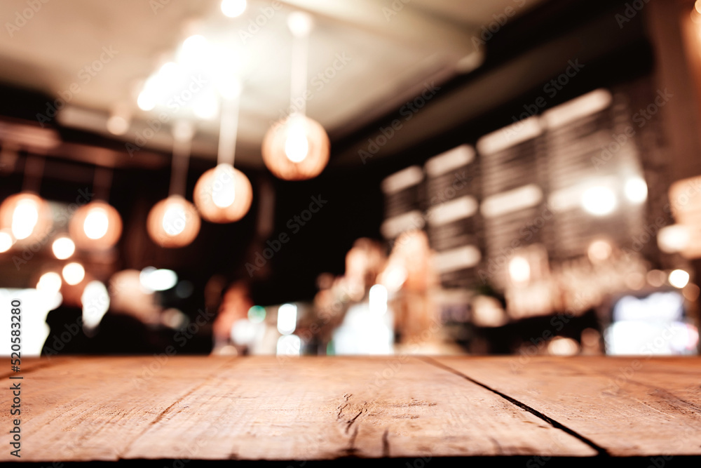 Empty blank wooden old deck table in front of abstract blurred festive ...