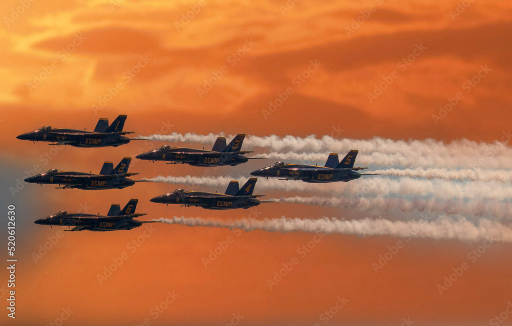 Six US Navy Blue Angel jets flying in formation at sunrise Stock Photo ...