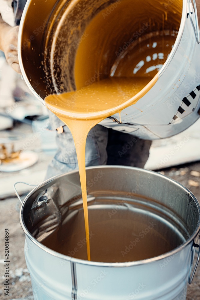 Mixture of yellow color with epoxy resin for industrial floors Stock ...