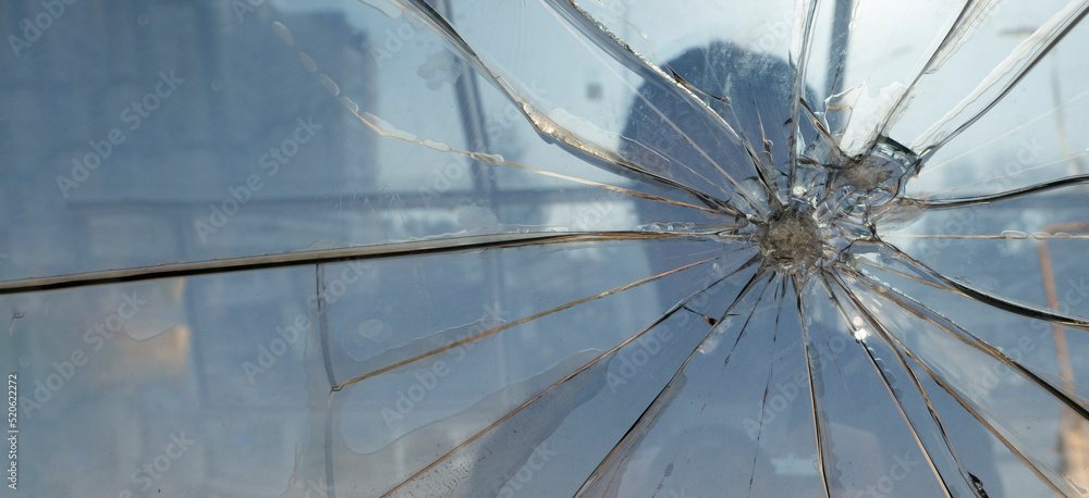 silhouette of a man behind broken glass Stock Photo | Adobe Stock