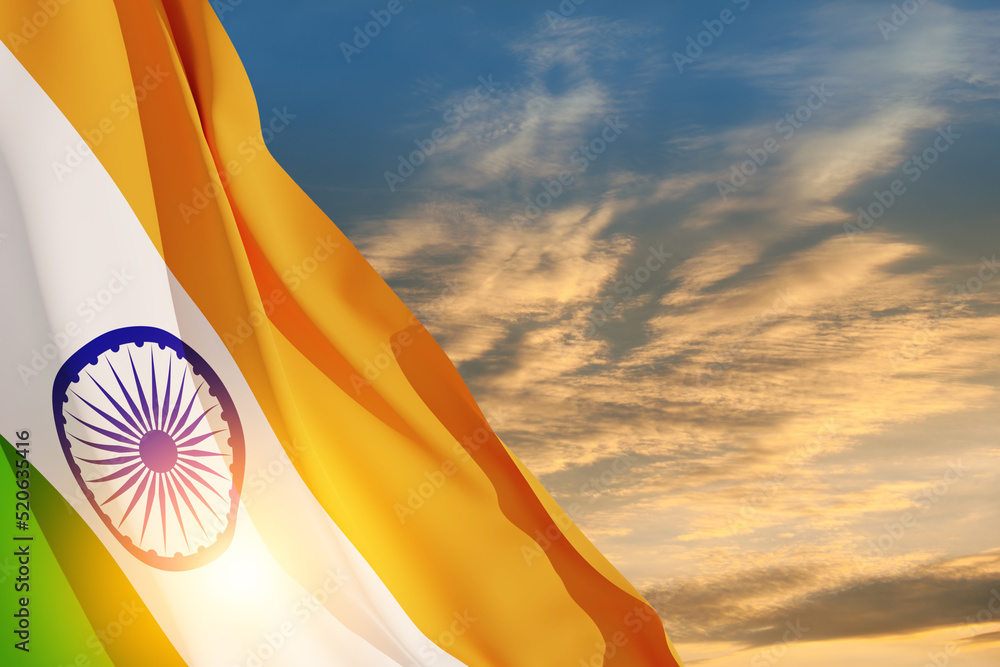 Waving India flag on sunset sky. Background with place for your text ...