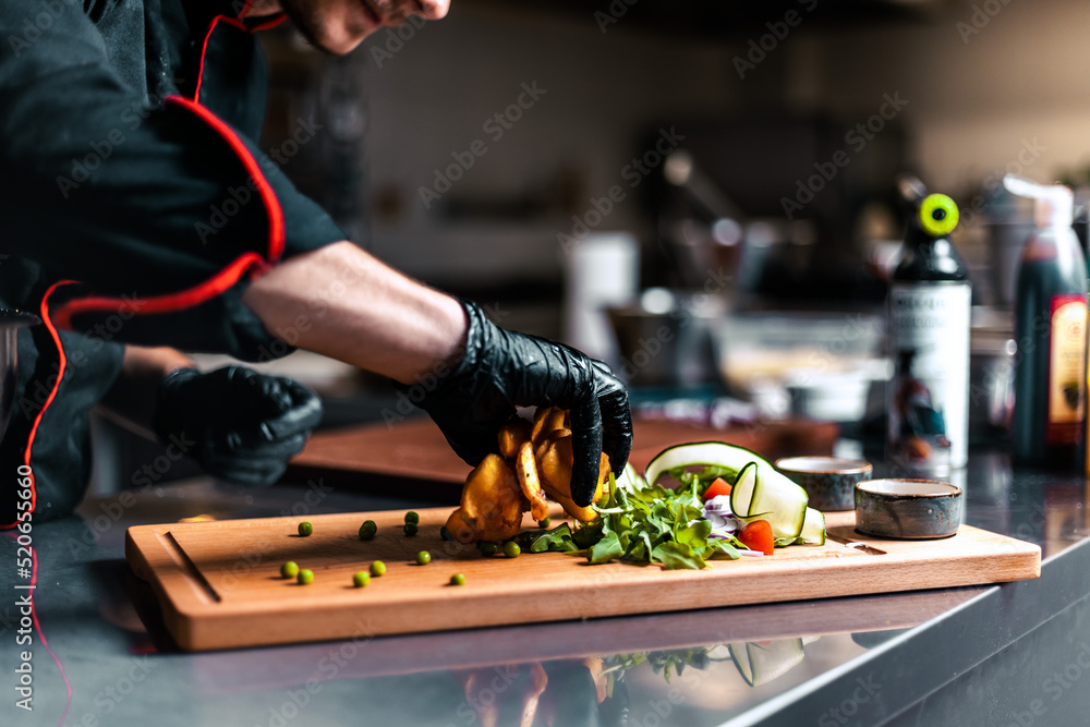 Chef serving food in the modern kitchen in a high-end restaurant Stock ...